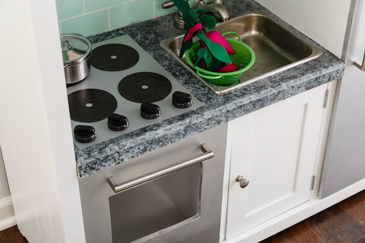 DIY play kitchen from an entertainment center