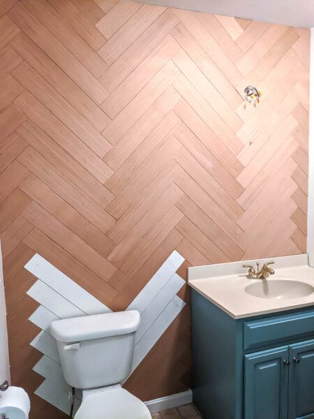 How to DIY a Herringbone Wood Wall on a Budget - Lovely Etc.