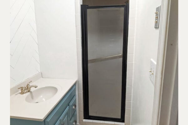 How to Paint a Shower Door Frame on the Cheap - Lovely Etc.